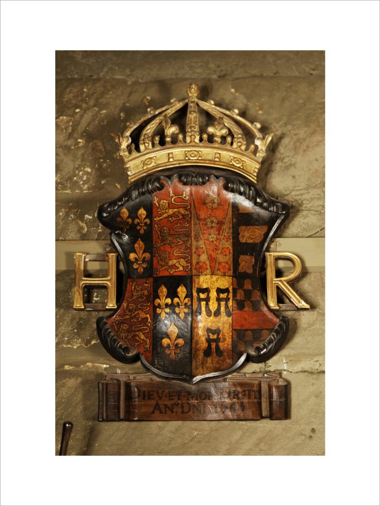 Coloured shield of the royal coat of arms of Henry VIII on the wall of ...