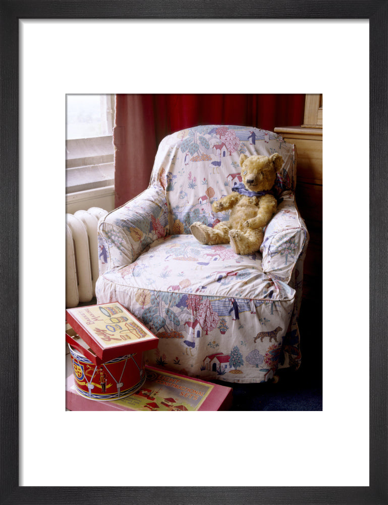 Lord Wraxall's Teddy Bear sitting on a chair with a nursery print cove ...