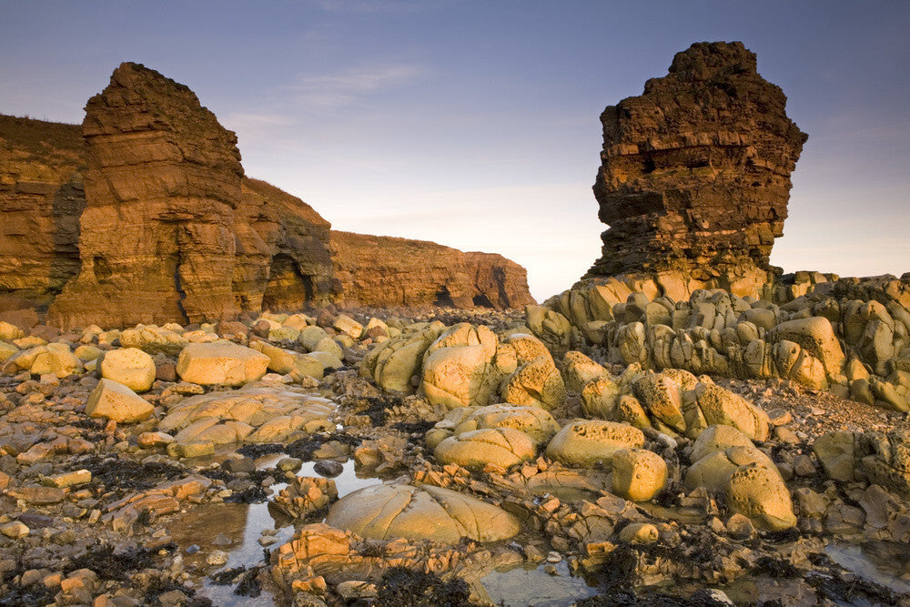 Sunrise on eroded sea stacks and rocks on The Leas, near Whitburn, Tyn ...