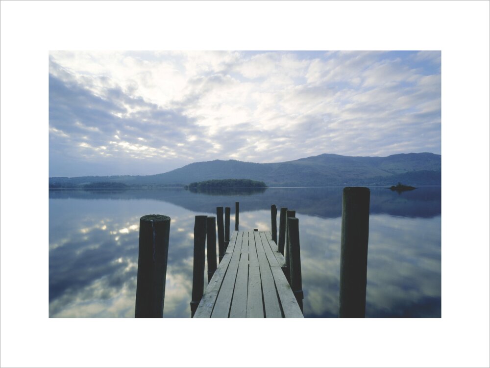 A landing stage at Hawse End with Castlerigg Fell on the far side of t ...