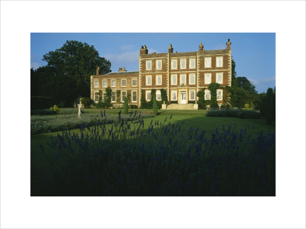 View of the front entrance of Gunby Hall with lawns and lavender beds ...