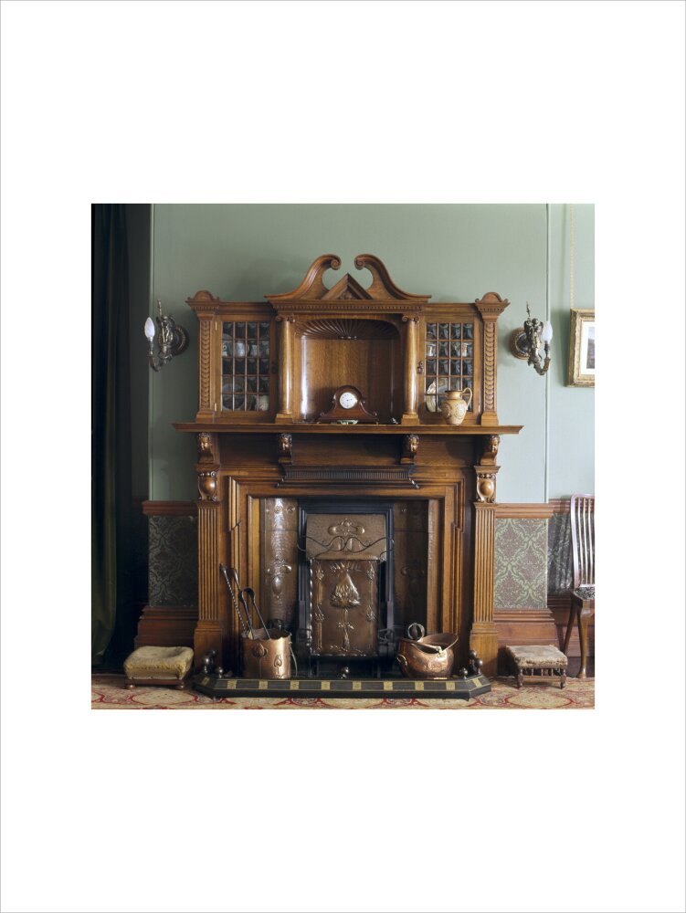 Close-up of the Dining Room wooden fireplace at Sunnycroft, with glass ...